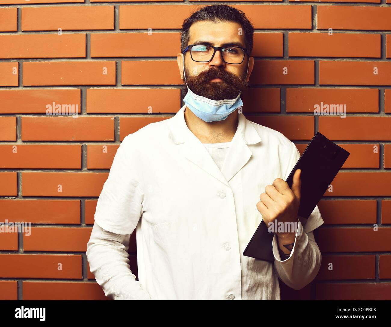 Bearded man, long beard. Brutal caucasian doctor or unshaven hipster ...