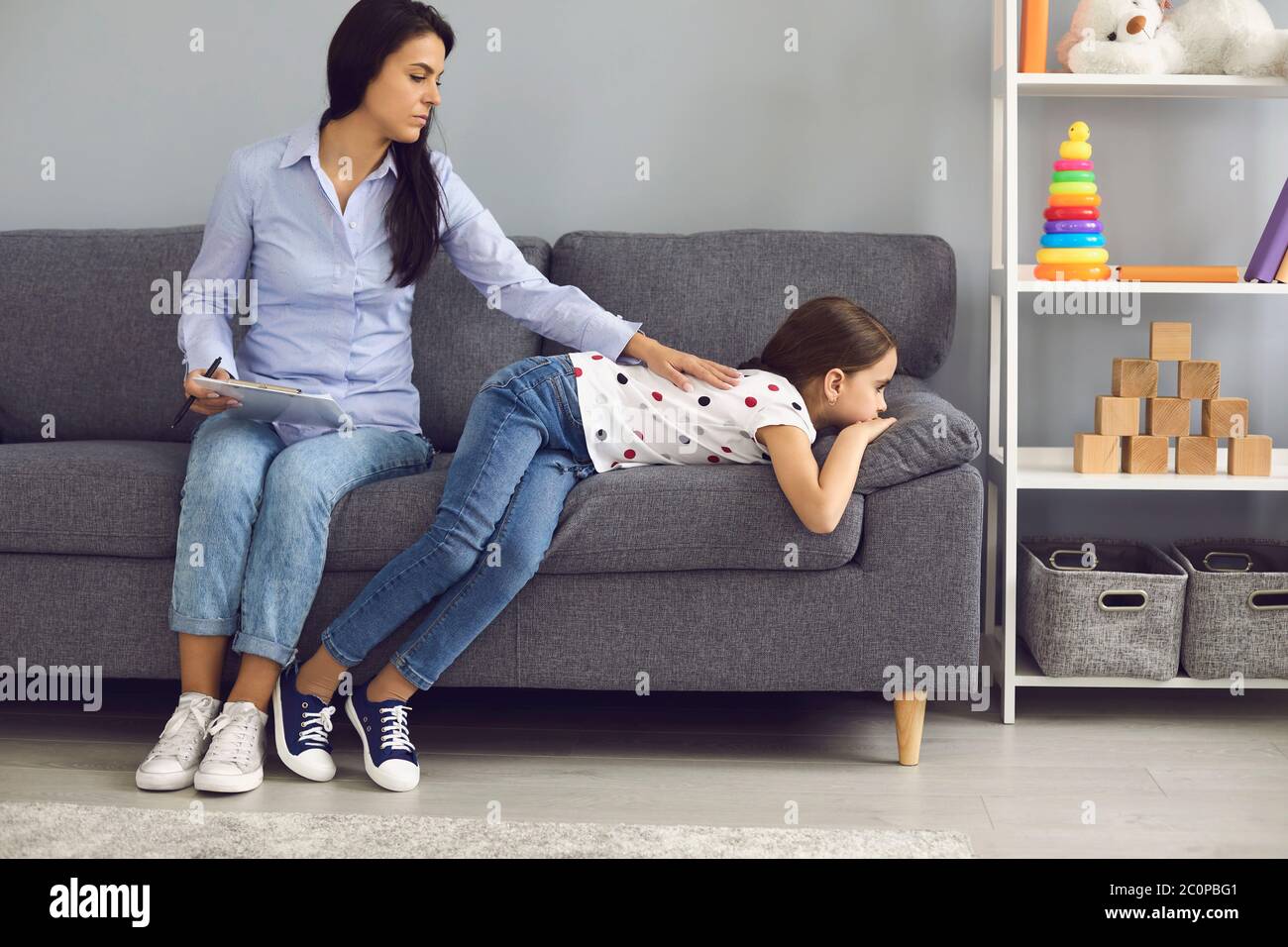 Child psychologist psychology. Woman psychologist with a clipboard ...