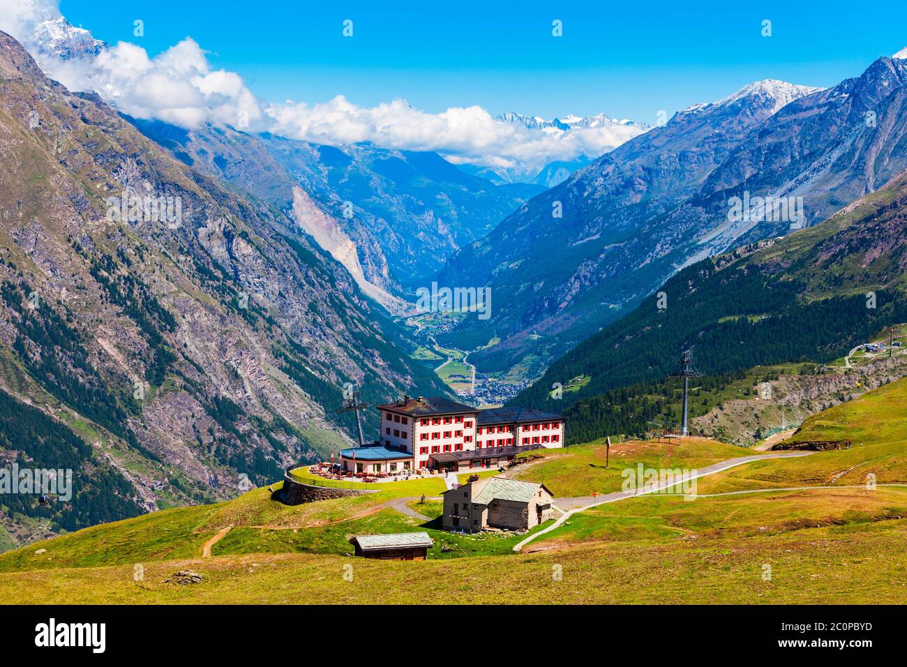 Cable car station and street cafe located near Zermatt town in the ...