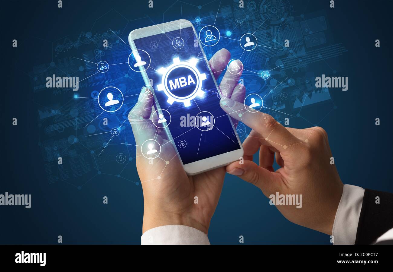 Female hand holding smartphone with MBA abbreviation, modern technology ...
