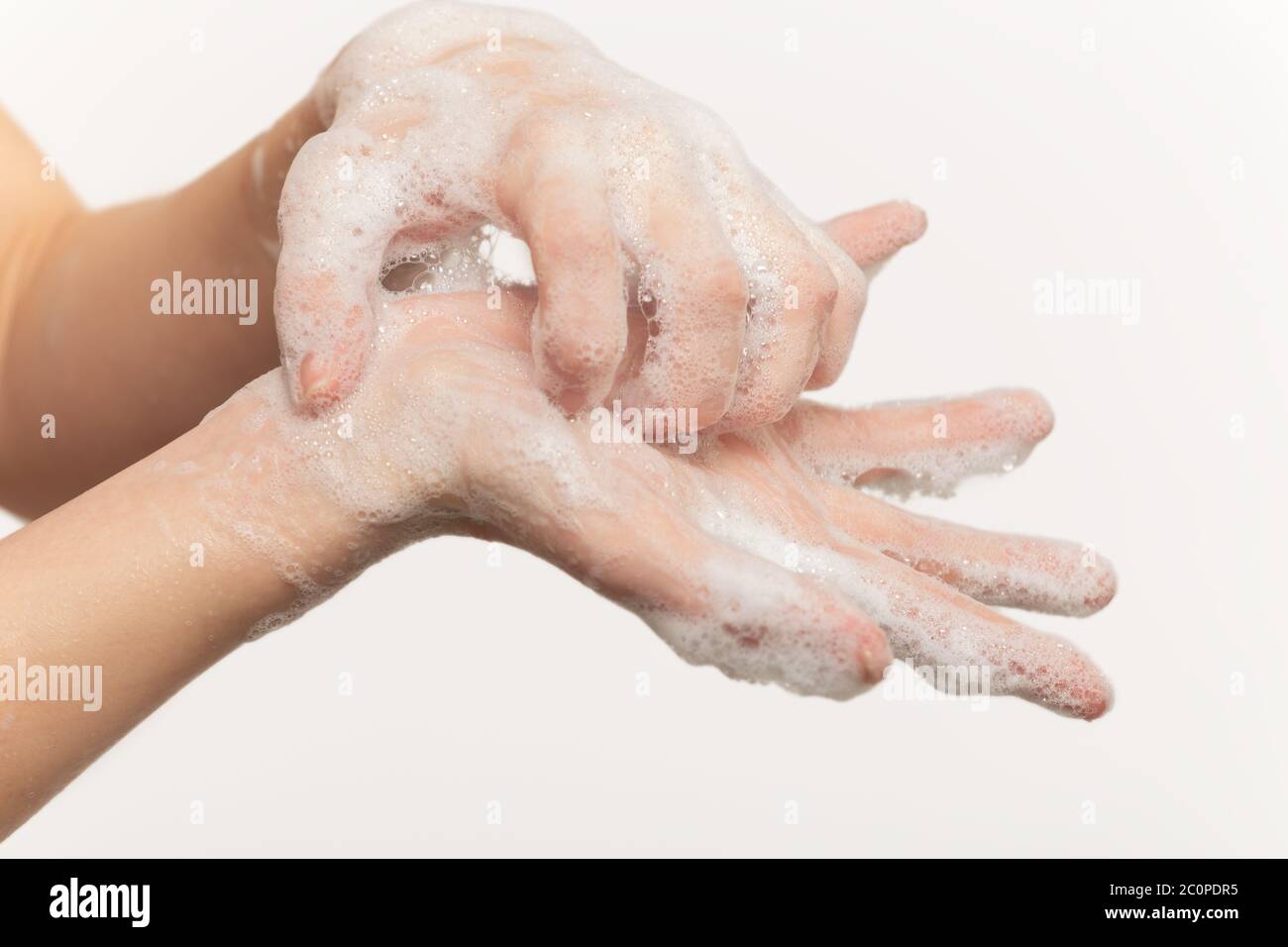 woman washing her hands closeup side view on white background Stock ...