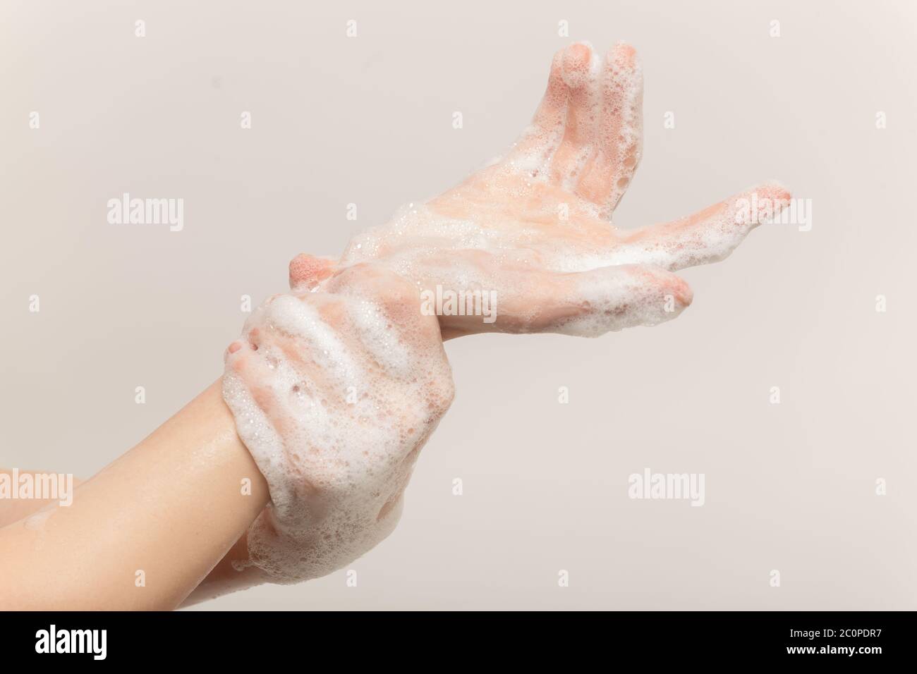 woman washing her hands closeup side view on white background Stock ...