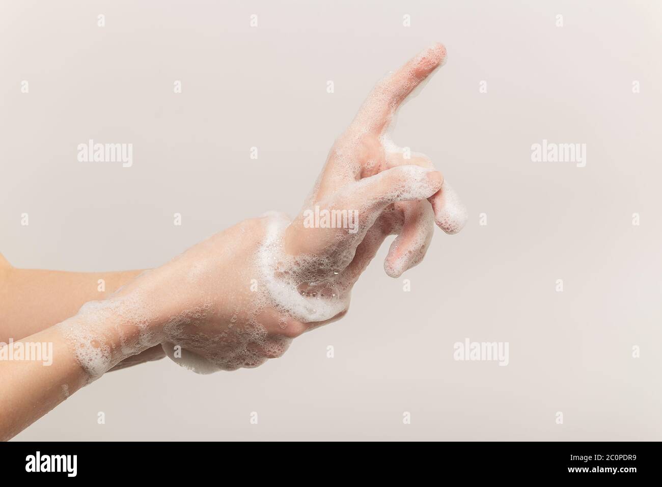 woman washing her arms closeup side view on white background Stock ...