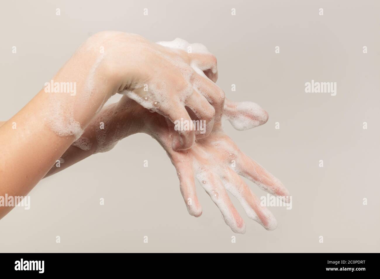woman washing her hands closeup side view on white background Stock ...