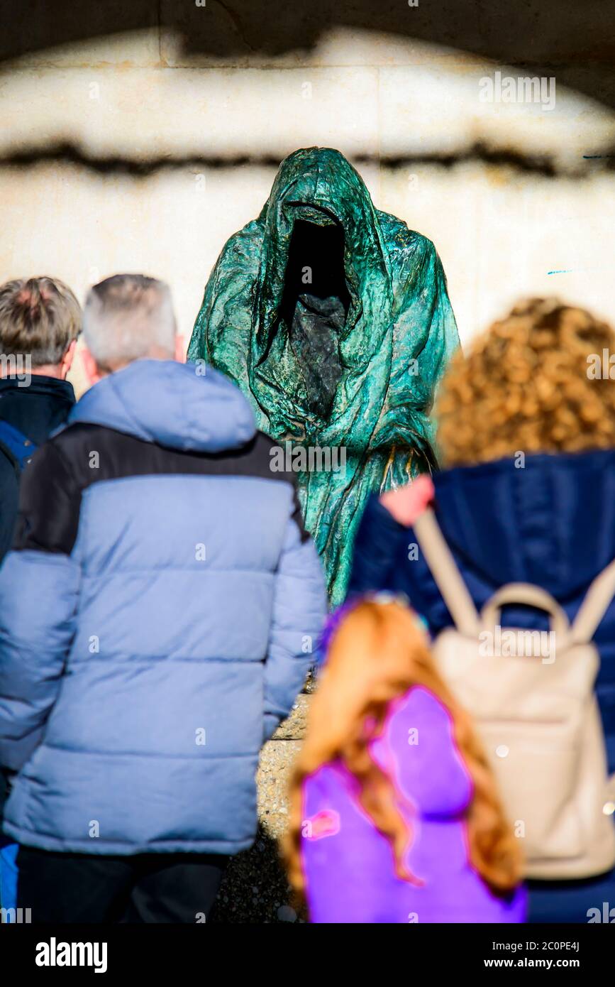 People looking at the Pietá statue by Anna Chromy at the side of the ...