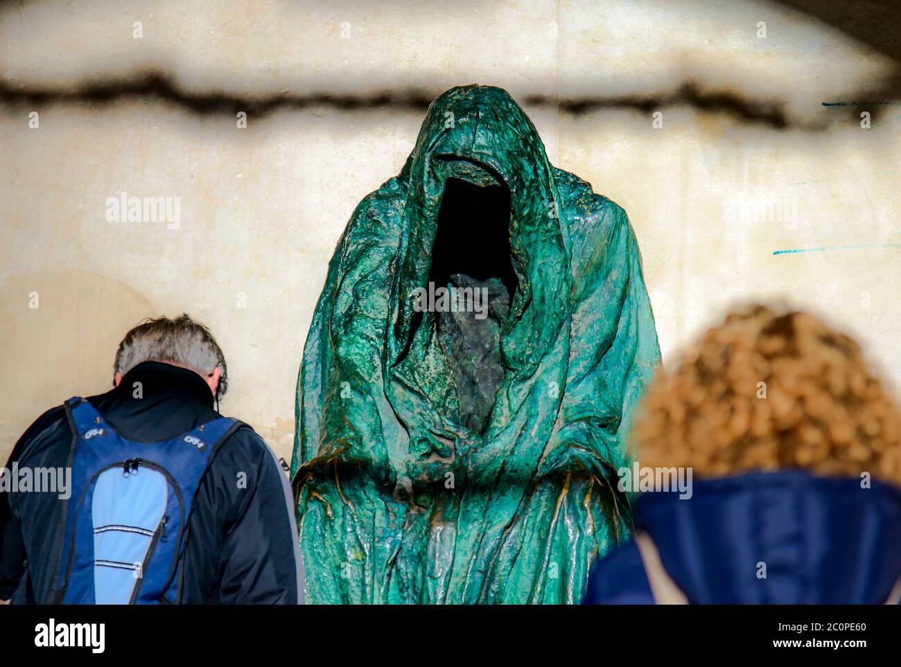 People looking at the Pietá statue by Anna Chromy at the side of the ...