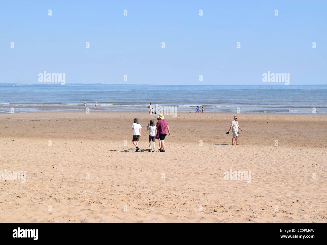 Teenagers walking on beach hi-res stock photography and images - Alamy