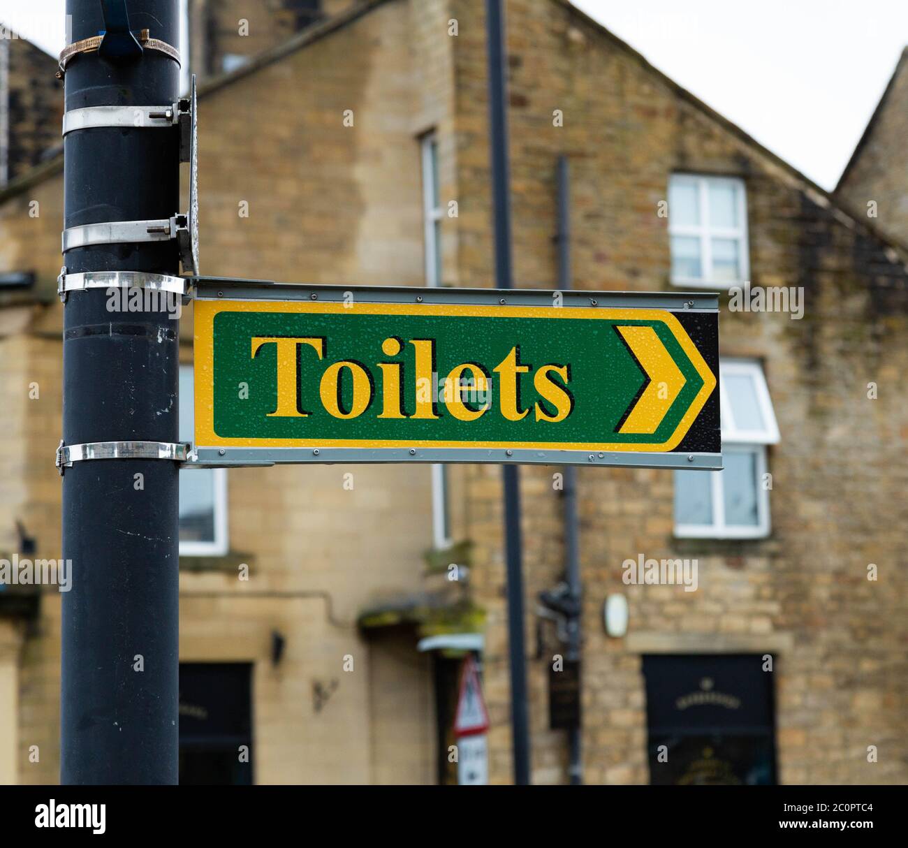 A public toilets directional sign in Baildon, Yorkshire Stock Photo - Alamy