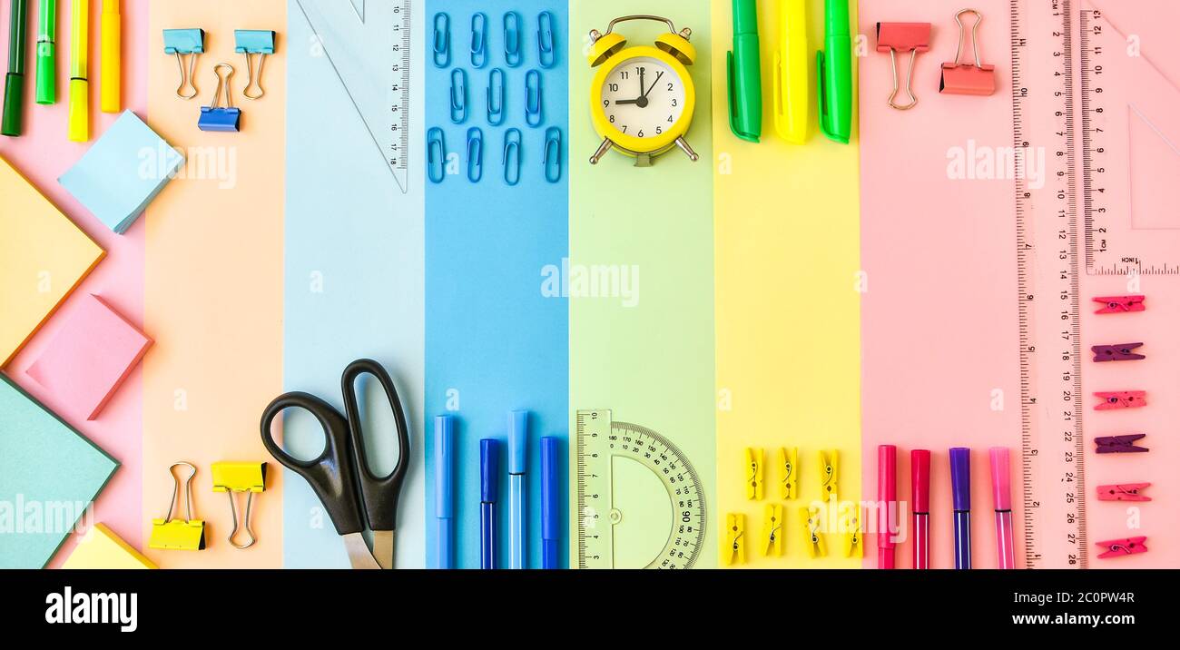 School Supplies In Frame With Colorful Paper Background. School or ...