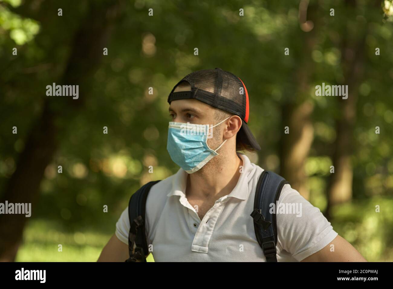 The guy takes off the mask from his face. Walk in the park Stock Photo ...