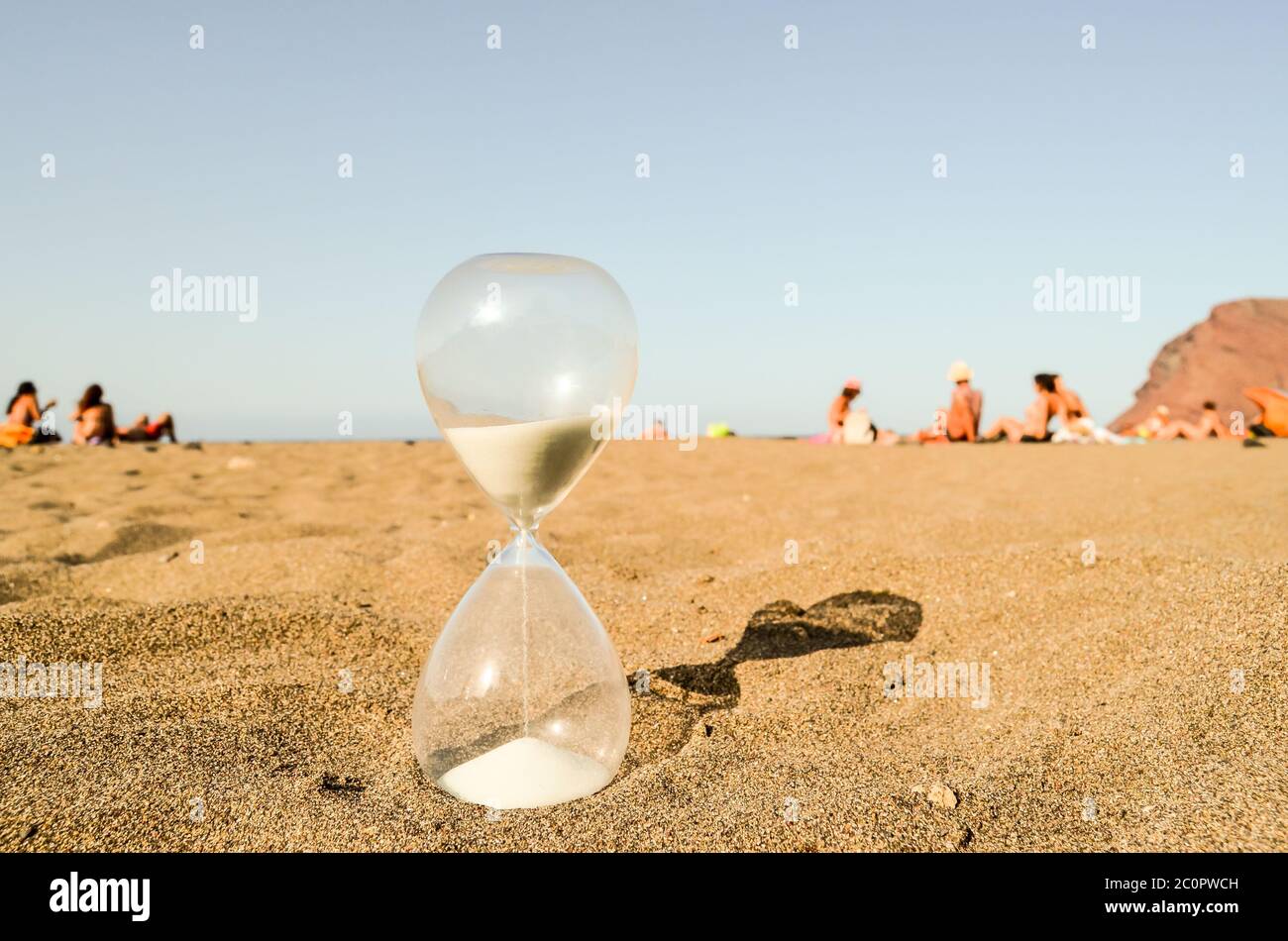 Hourglass Clock on the Sand Beach Stock Photo - Alamy