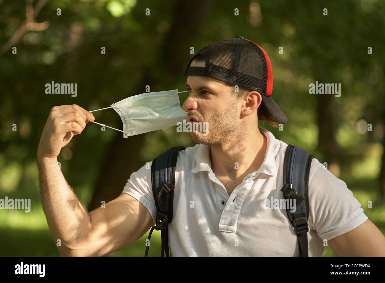 Guy takes off mask from hi-res stock photography and images - Alamy