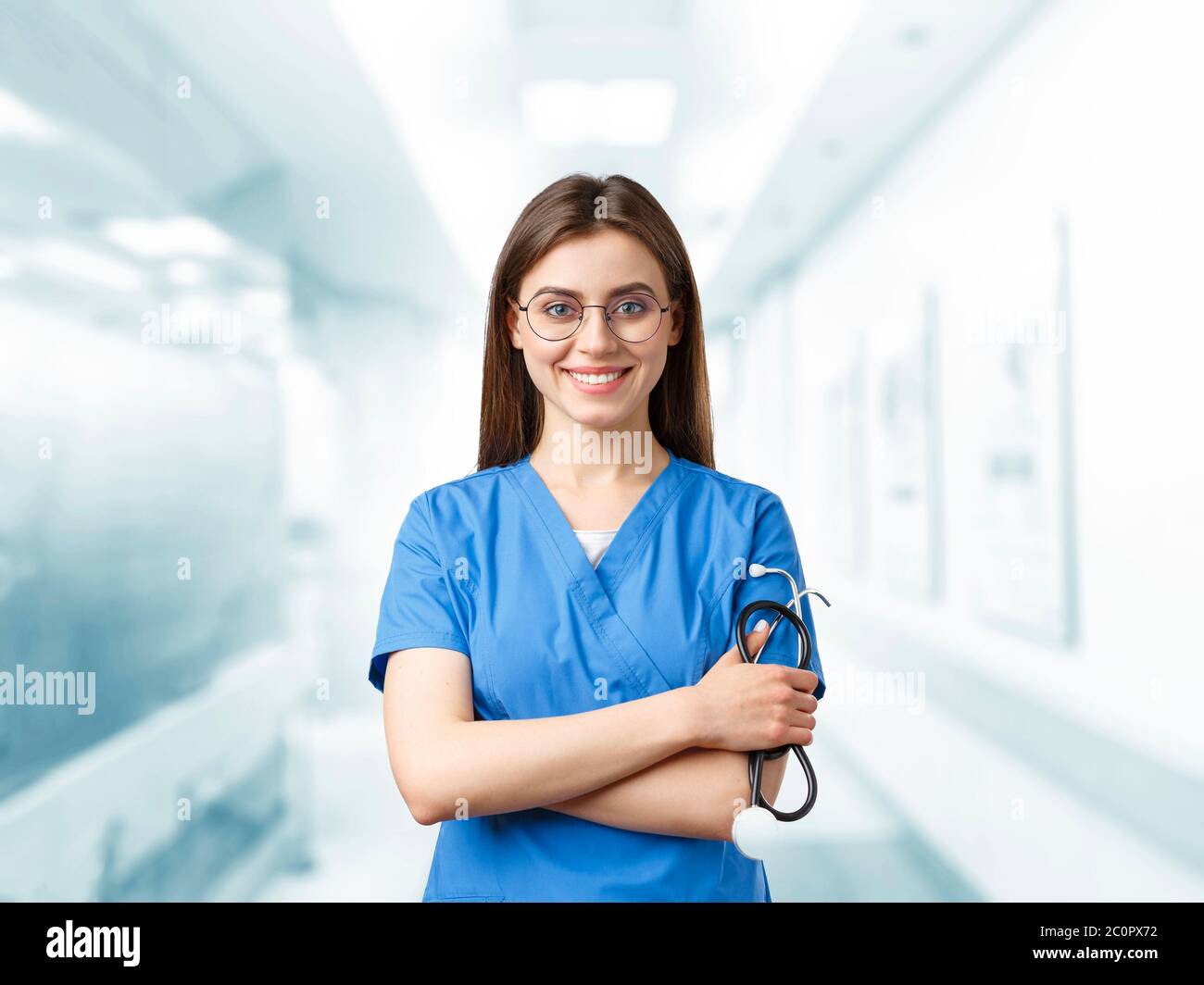 Detail of a nurse uniform on a blue blurred hallway hospital background ...