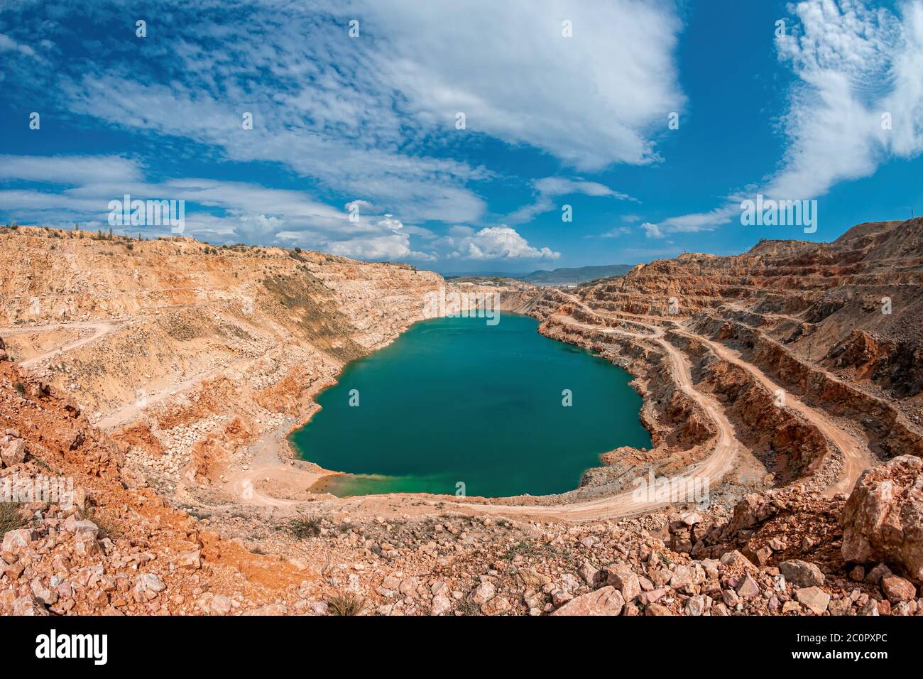 Emerald green lake in flooded opencast mine, open pit. Oval lake in ...