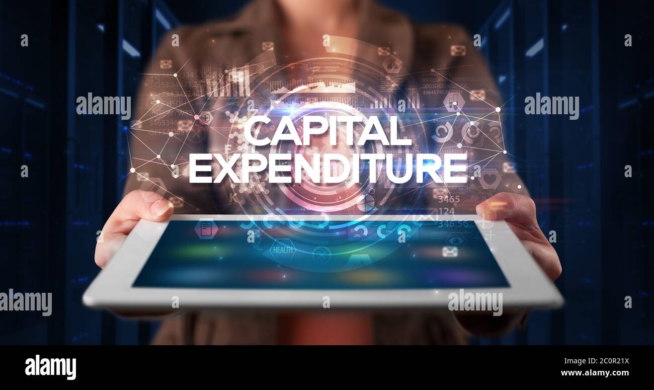 Young business person working on tablet and shows the inscription ...