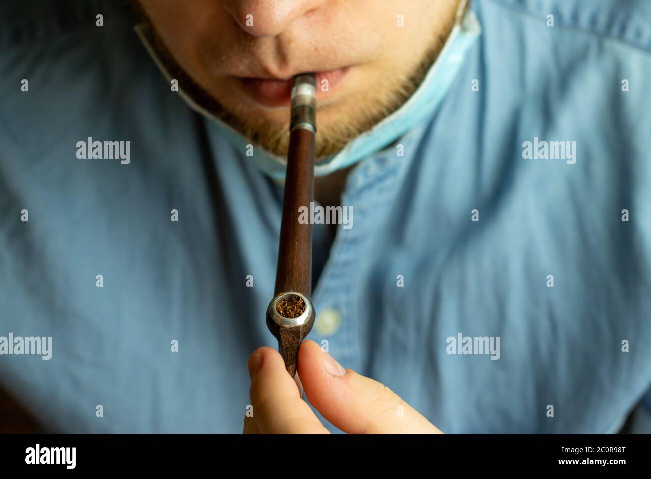 Man holding vintage smoking pipe in hand. Male smoking tobacco Stock ...