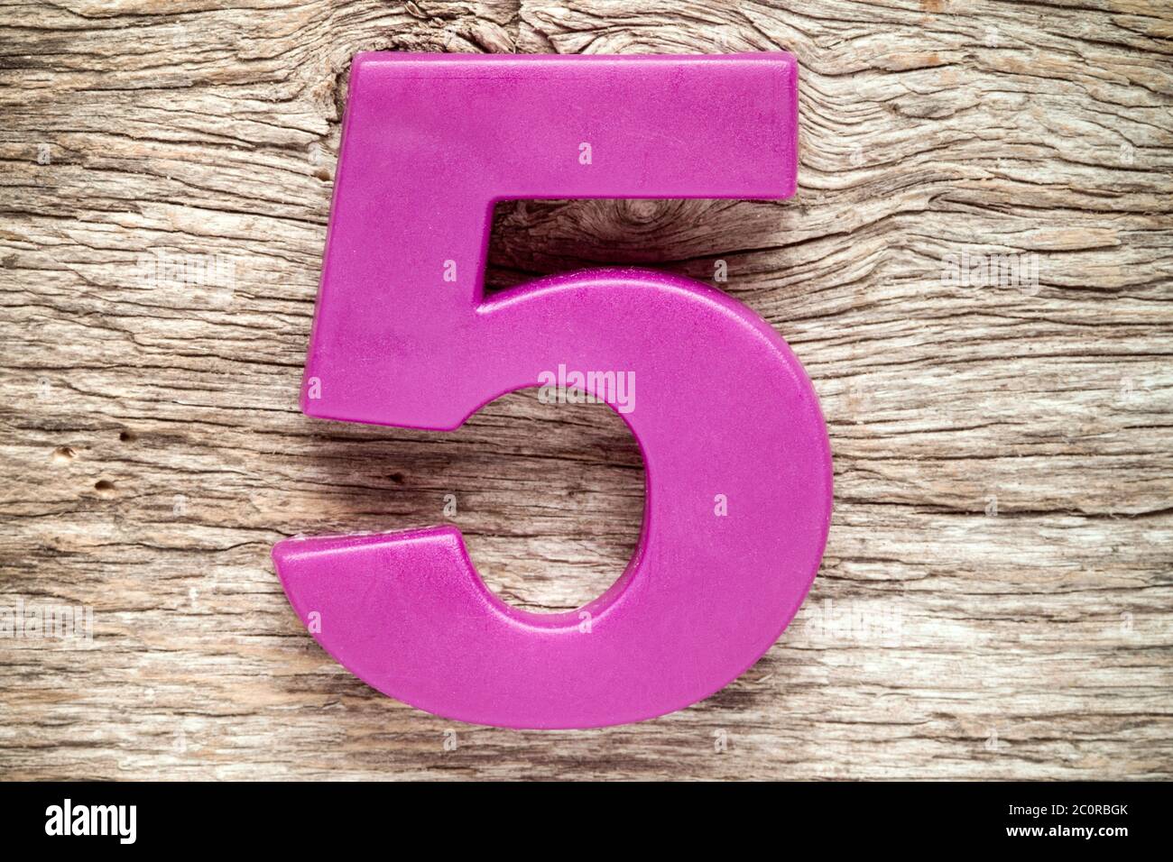 Purple number five Stock Photo - Alamy