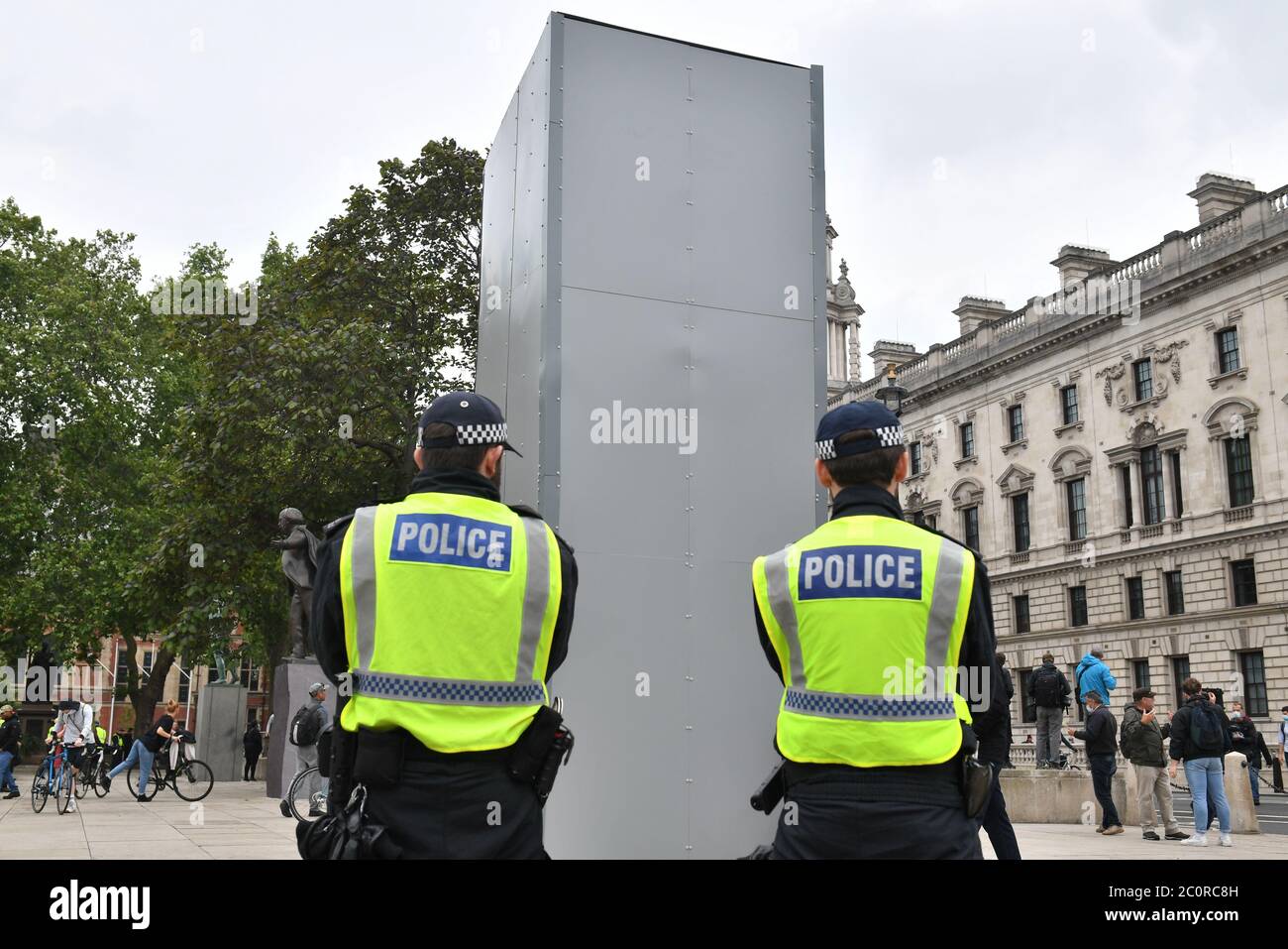 Police officers stand beside hi-res stock photography and images - Alamy