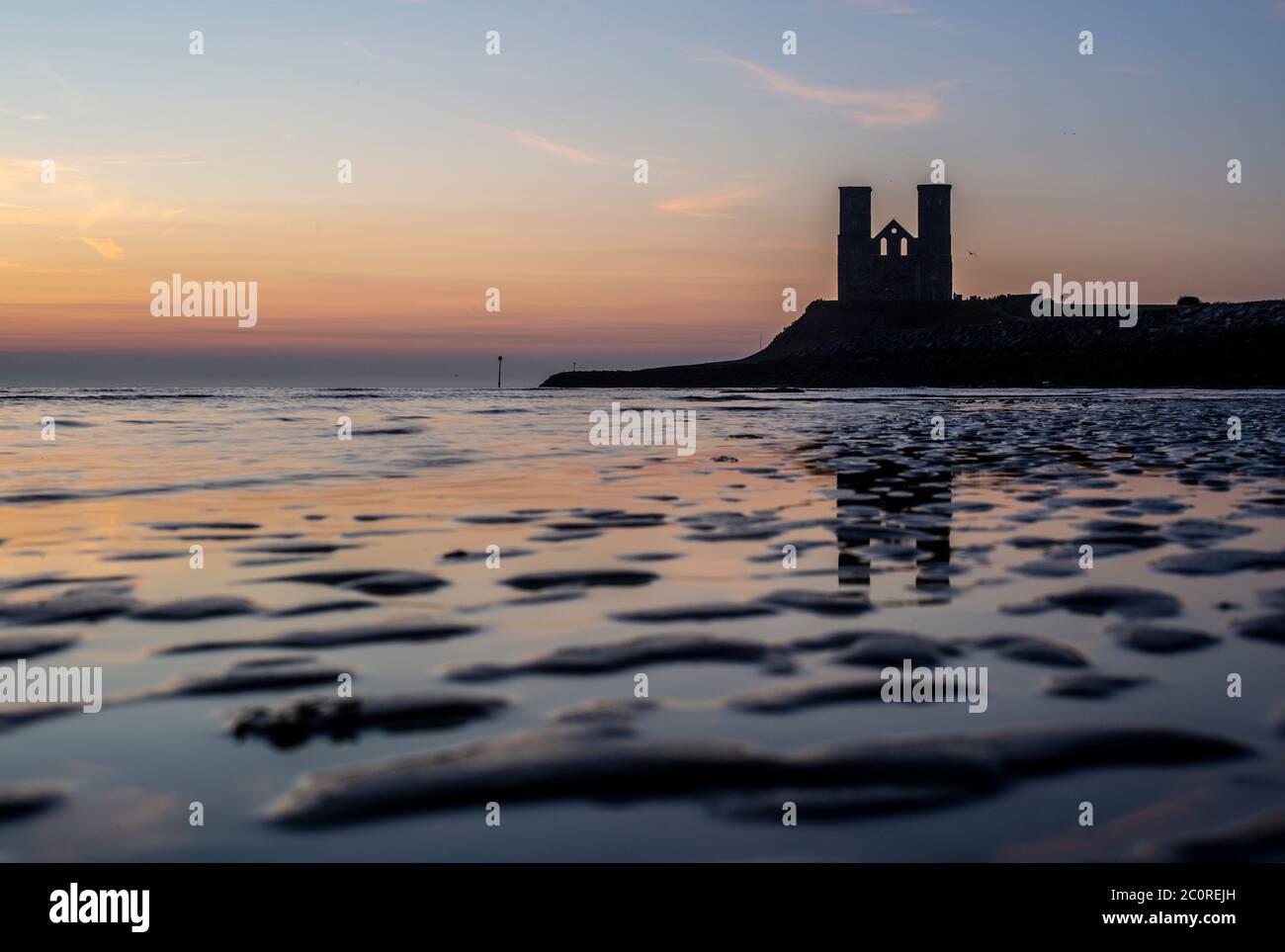 Silhouette of medieval Reculver Towers at sunrise, Kent Stock Photo - Alamy
