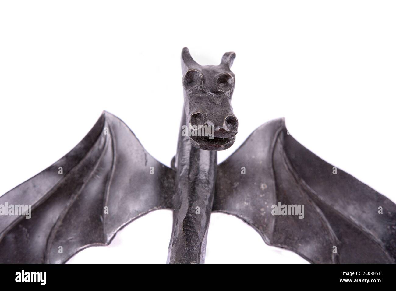 Forged dragon on a white background Stock Photo - Alamy