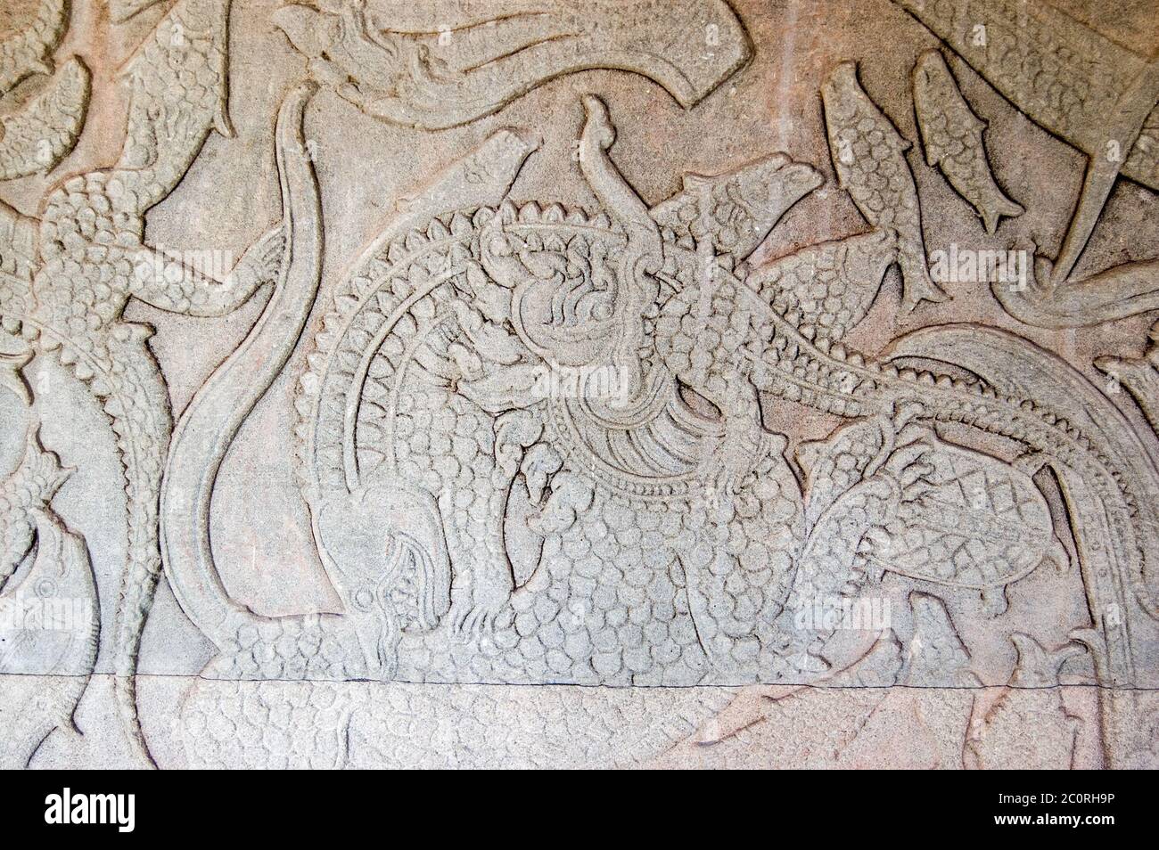 Ancient Kymer carving of the creation of the world with god fighting ...