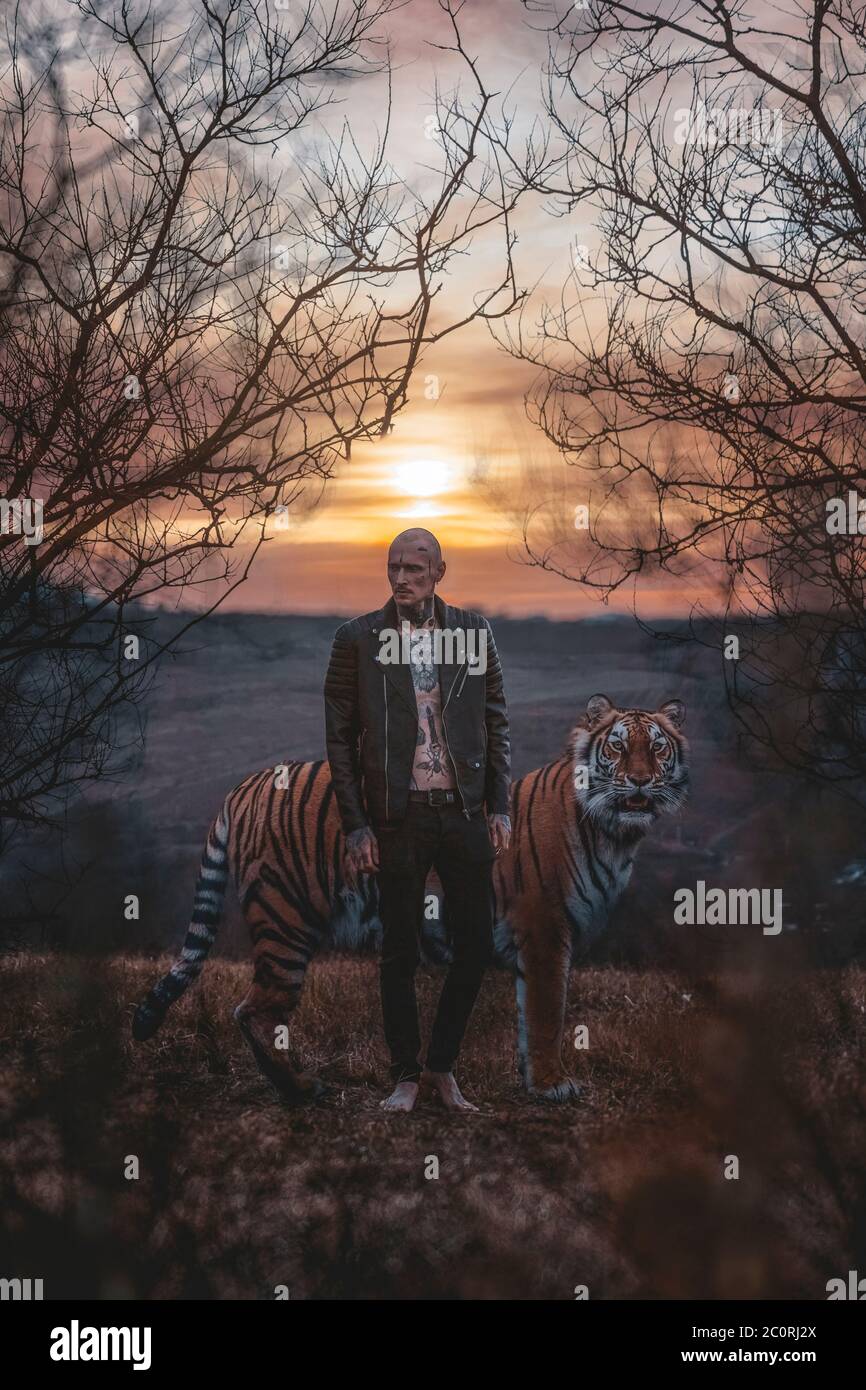 Man hug tiger hi-res stock photography and images - Alamy