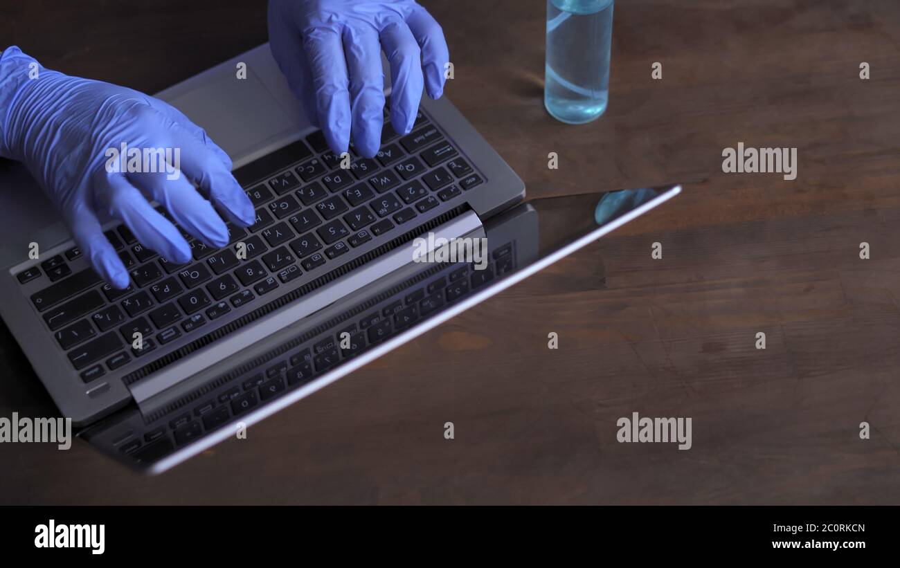 Computer keyboard hands gloves typing hi-res stock photography and ...