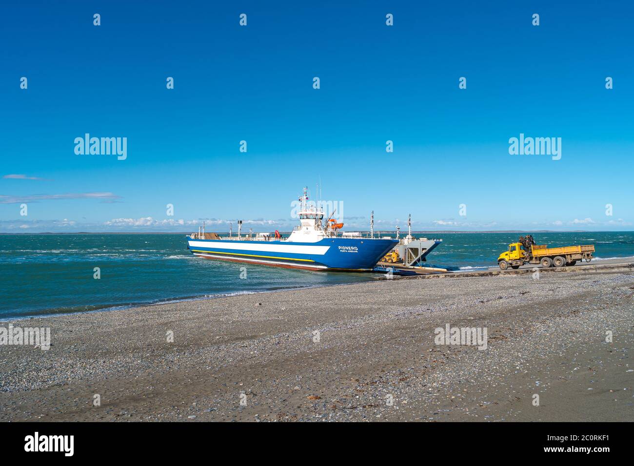 Ferry is taking cargo with cars and touristic buses at Punta Delgada ...