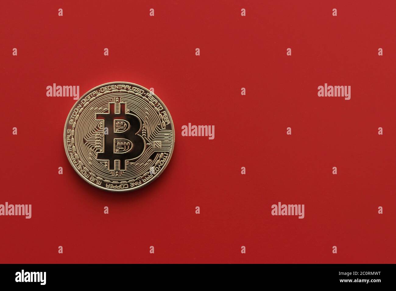 Bitcoin on red backdrop Stock Photo - Alamy