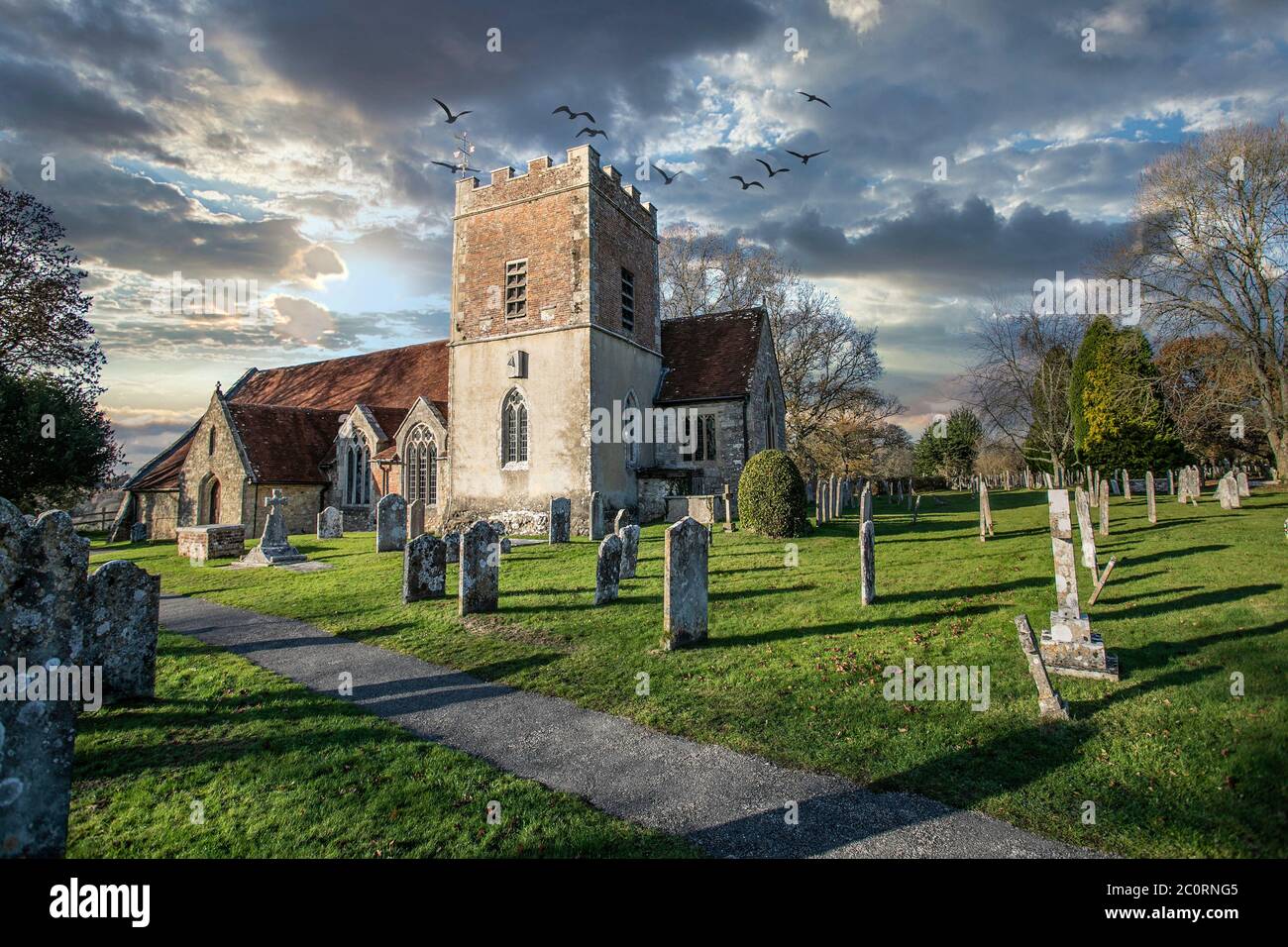 English country church and graveyard, with interesting sky and ...