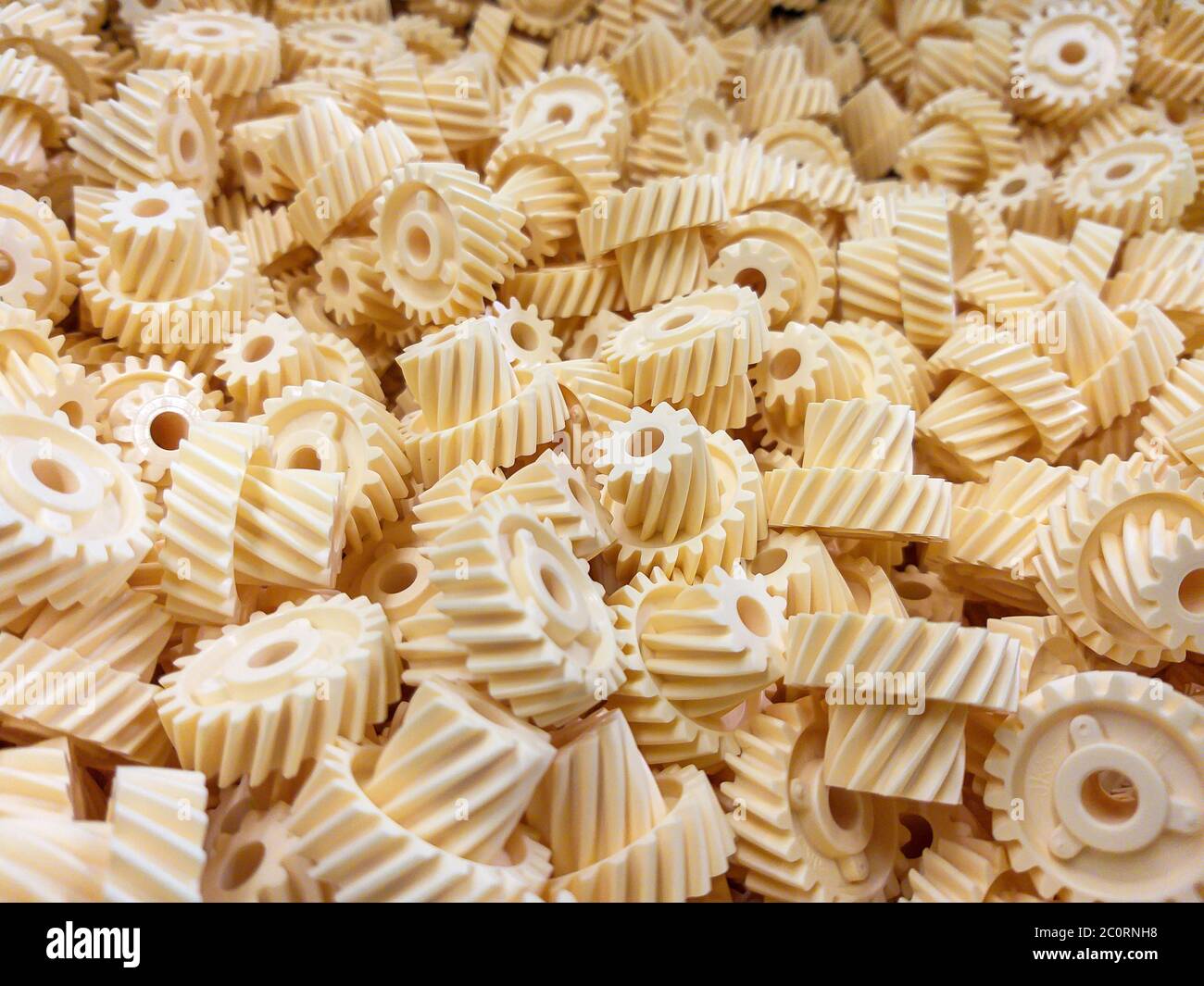 Background with cogwheels made of plastic Stock Photo - Alamy