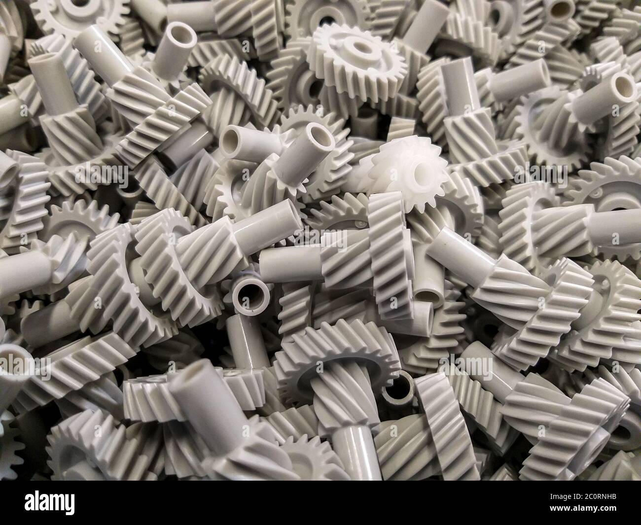 Background with cogwheels made of plastic Stock Photo - Alamy