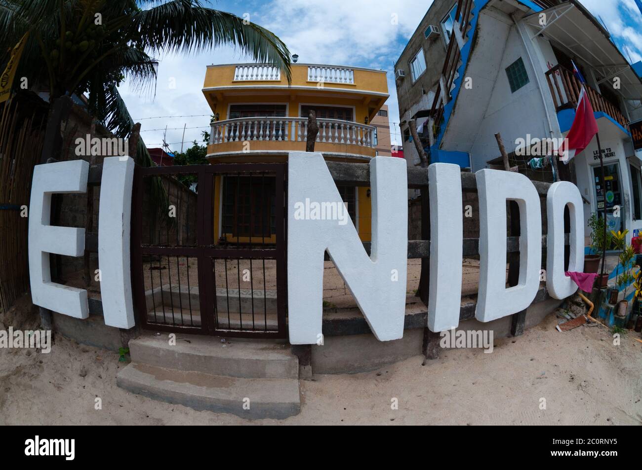 El Nido sign at the beach in front of houses Stock Photo - Alamy