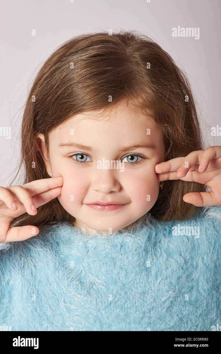 Portrait of a small smiling girl. Happy emotions Stock Photo - Alamy