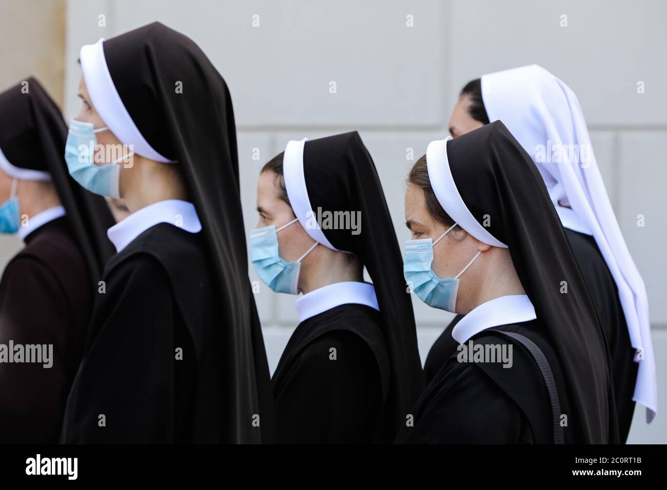 Nuns wearing face masks as a preventive measure during the procession ...