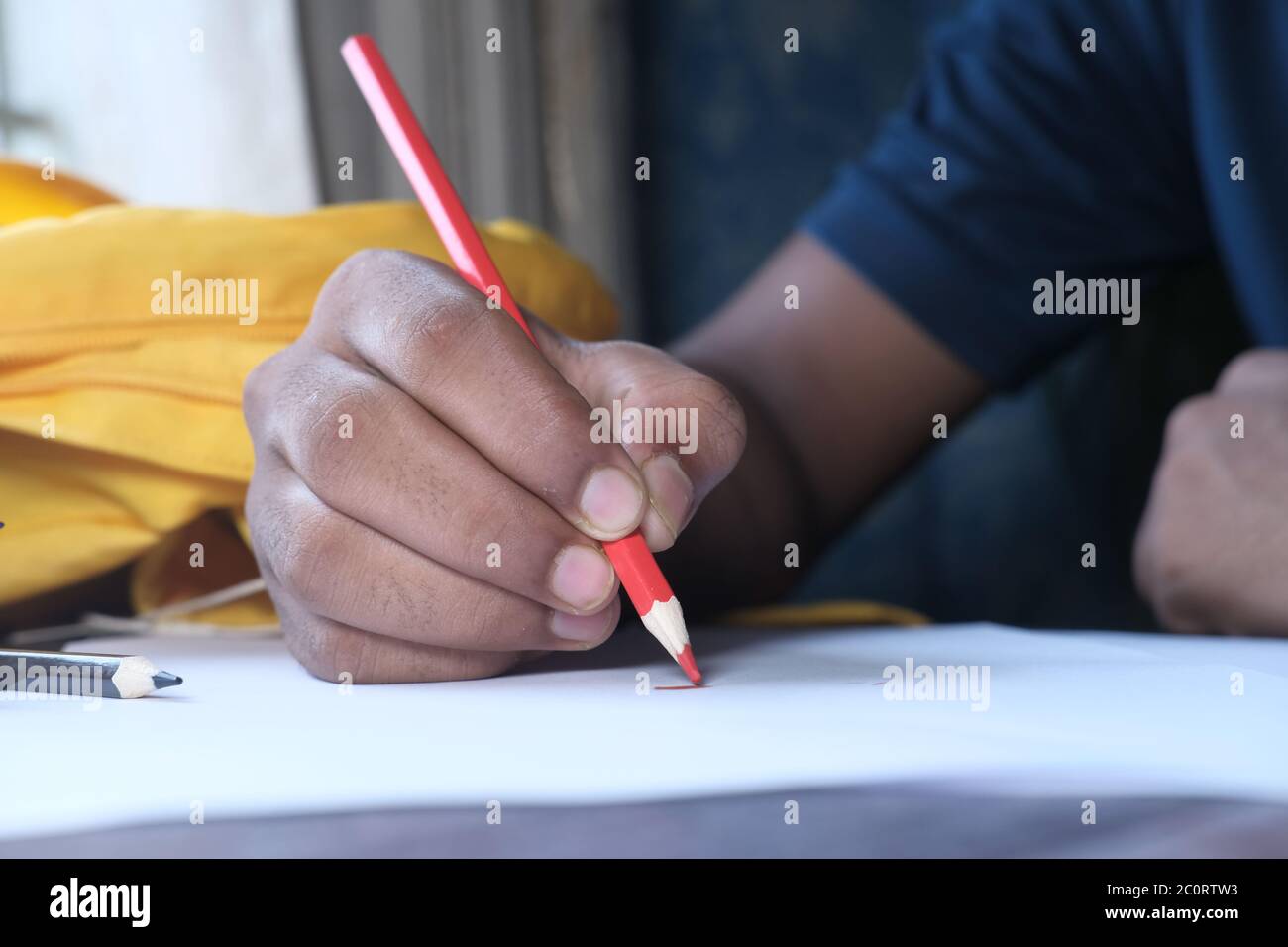 child boy drawing with colored pencil on a page Stock Photo - Alamy