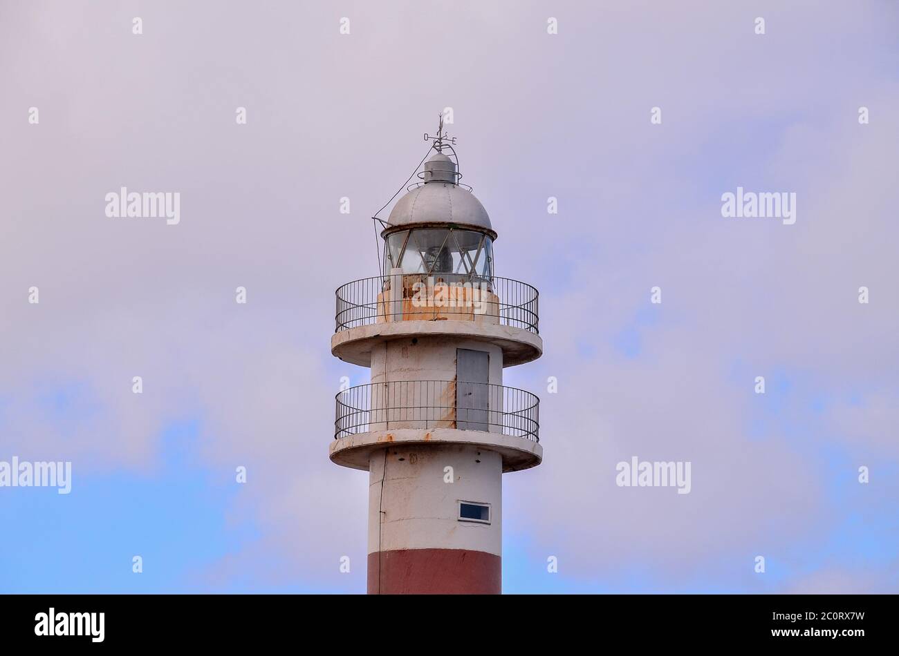 High Lighthouse near the Coast Stock Photo - Alamy