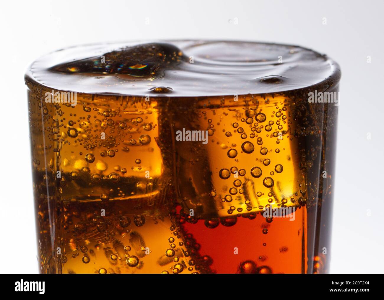 Cold refreshing soft drink with ice on a white background Stock Photo ...