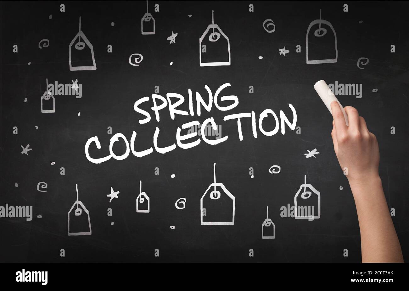 Hand drawing SPRING COLLECTION inscription with white chalk on ...