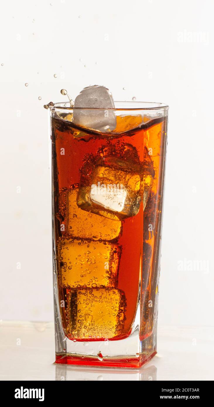 Cold refreshing soft drink with ice on a white background Stock Photo ...