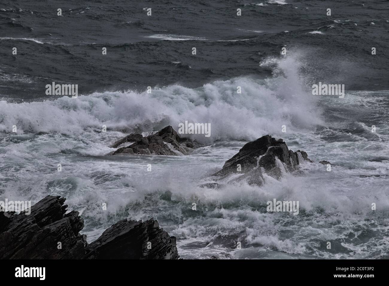 Rocks and stormy seas Stock Photo - Alamy