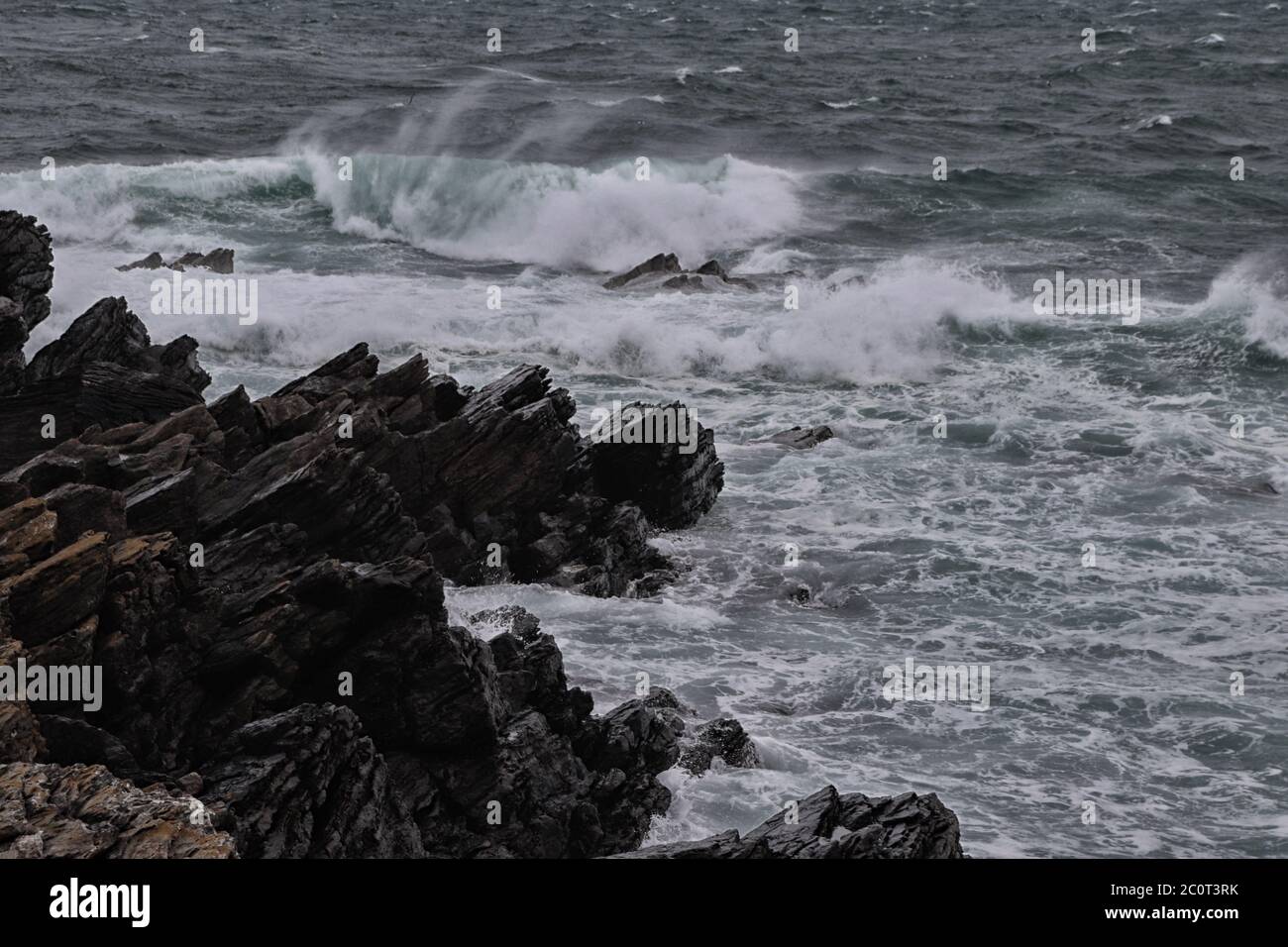 Rocks and stormy seas Stock Photo - Alamy