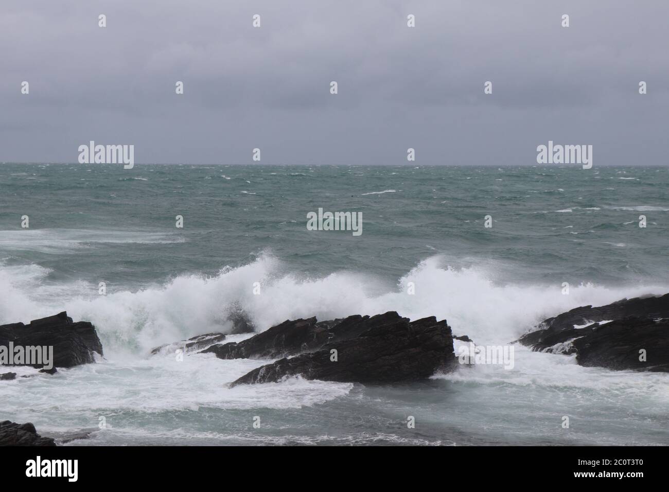 Rocks and stormy seas Stock Photo - Alamy