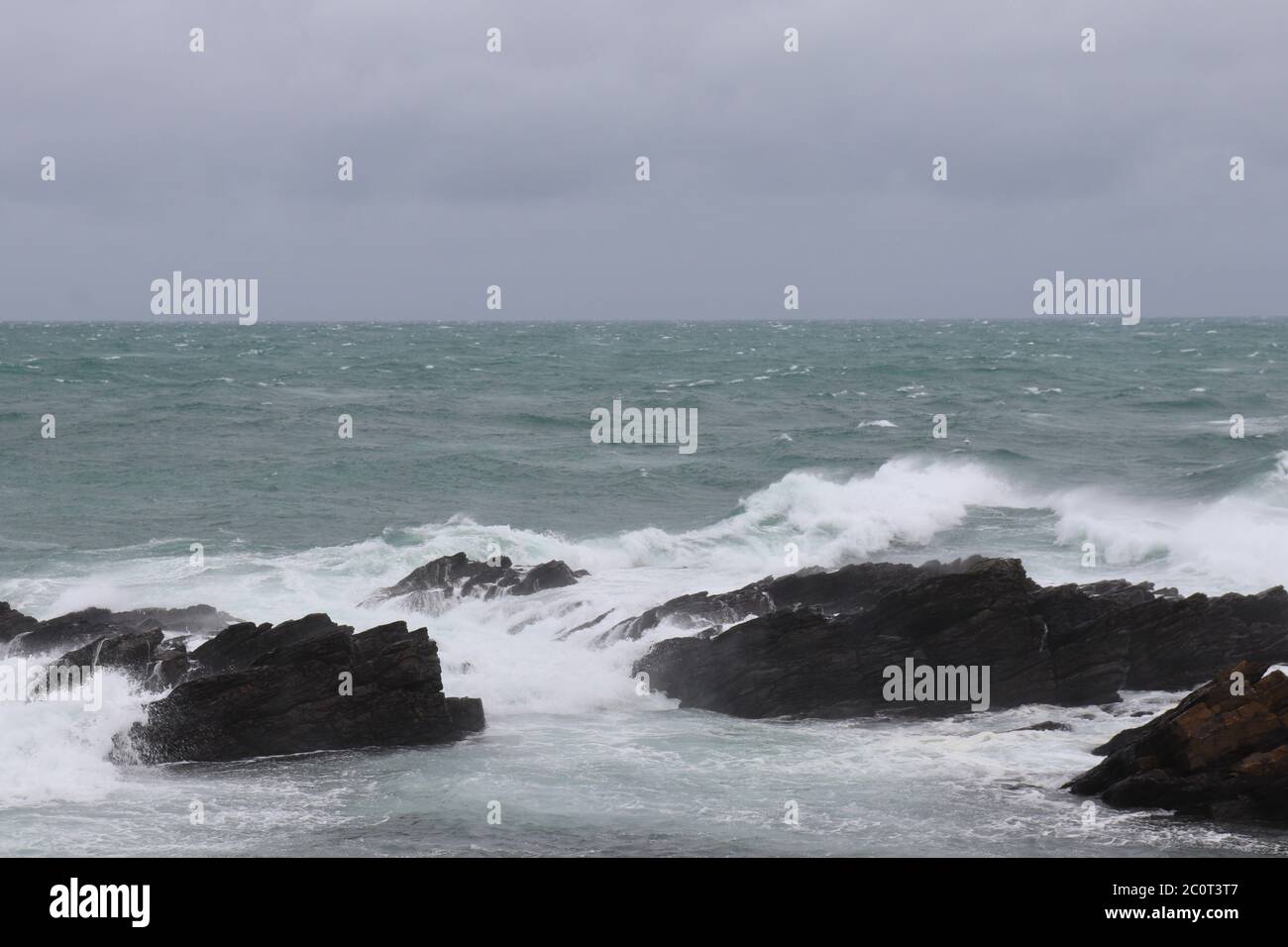 Rocks and stormy seas Stock Photo - Alamy