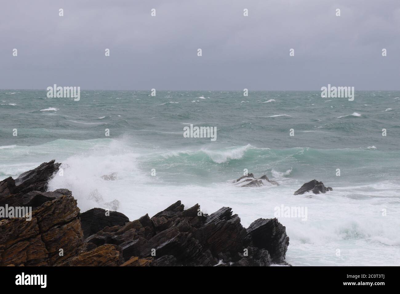 Rocks and stormy seas Stock Photo - Alamy