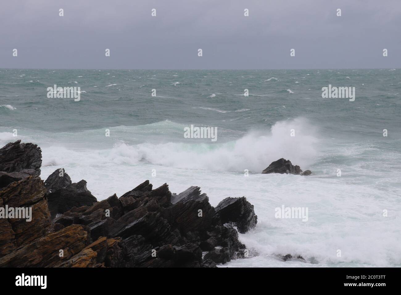 Rocks and stormy seas Stock Photo - Alamy