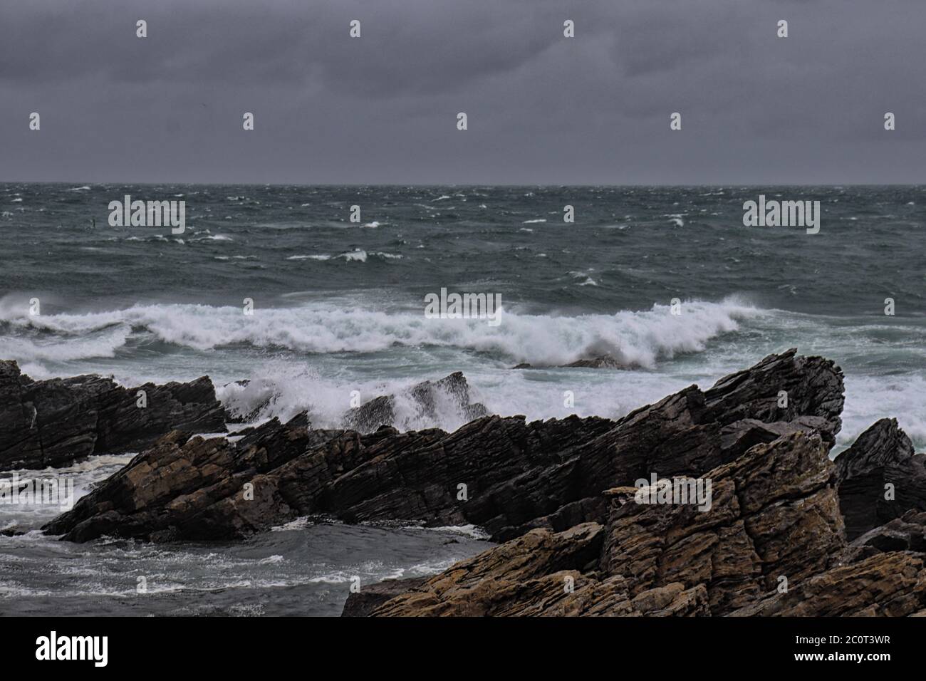 Rocks and stormy seas Stock Photo - Alamy
