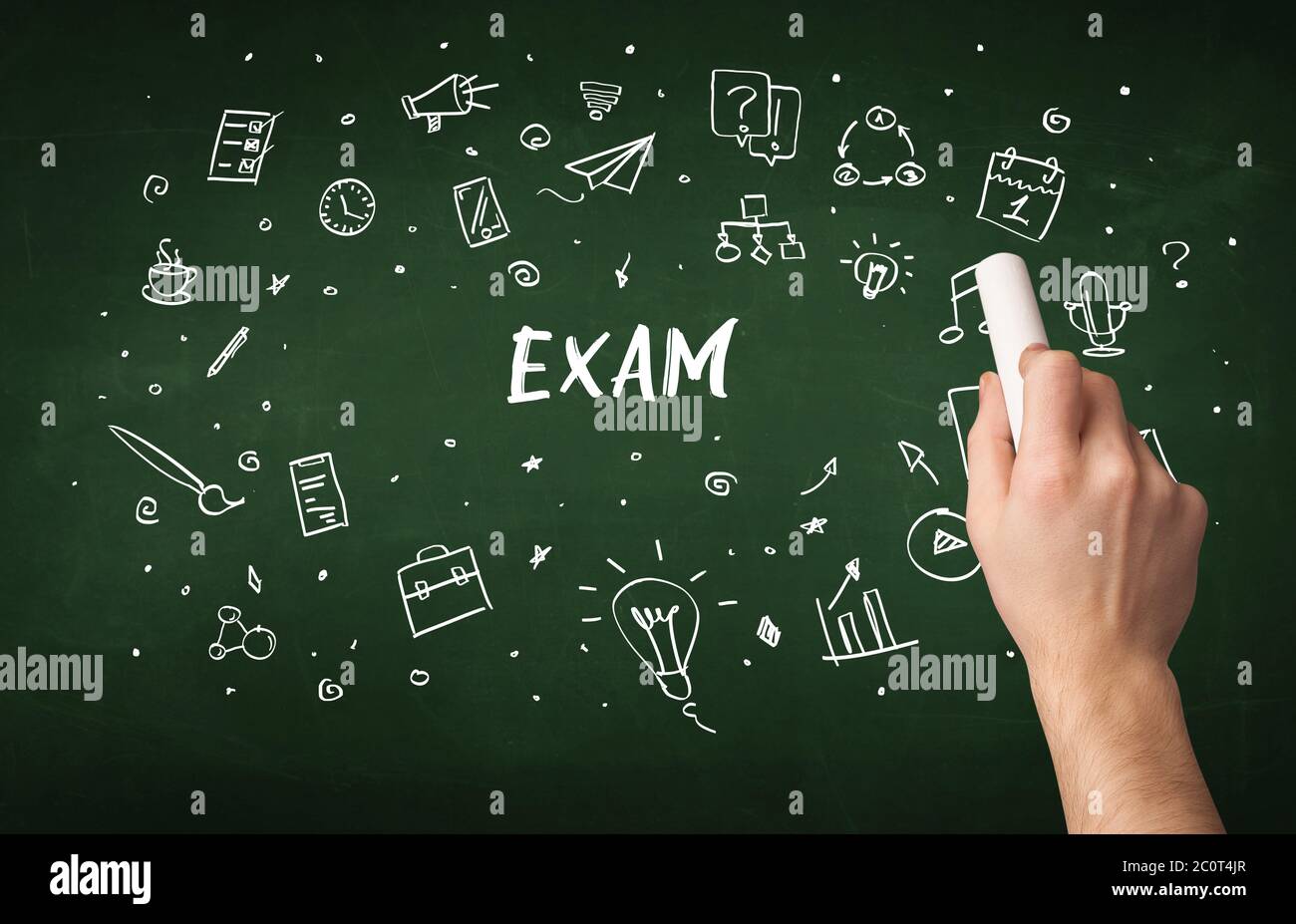 Hand drawing EXAM inscription with white chalk on blackboard, education ...