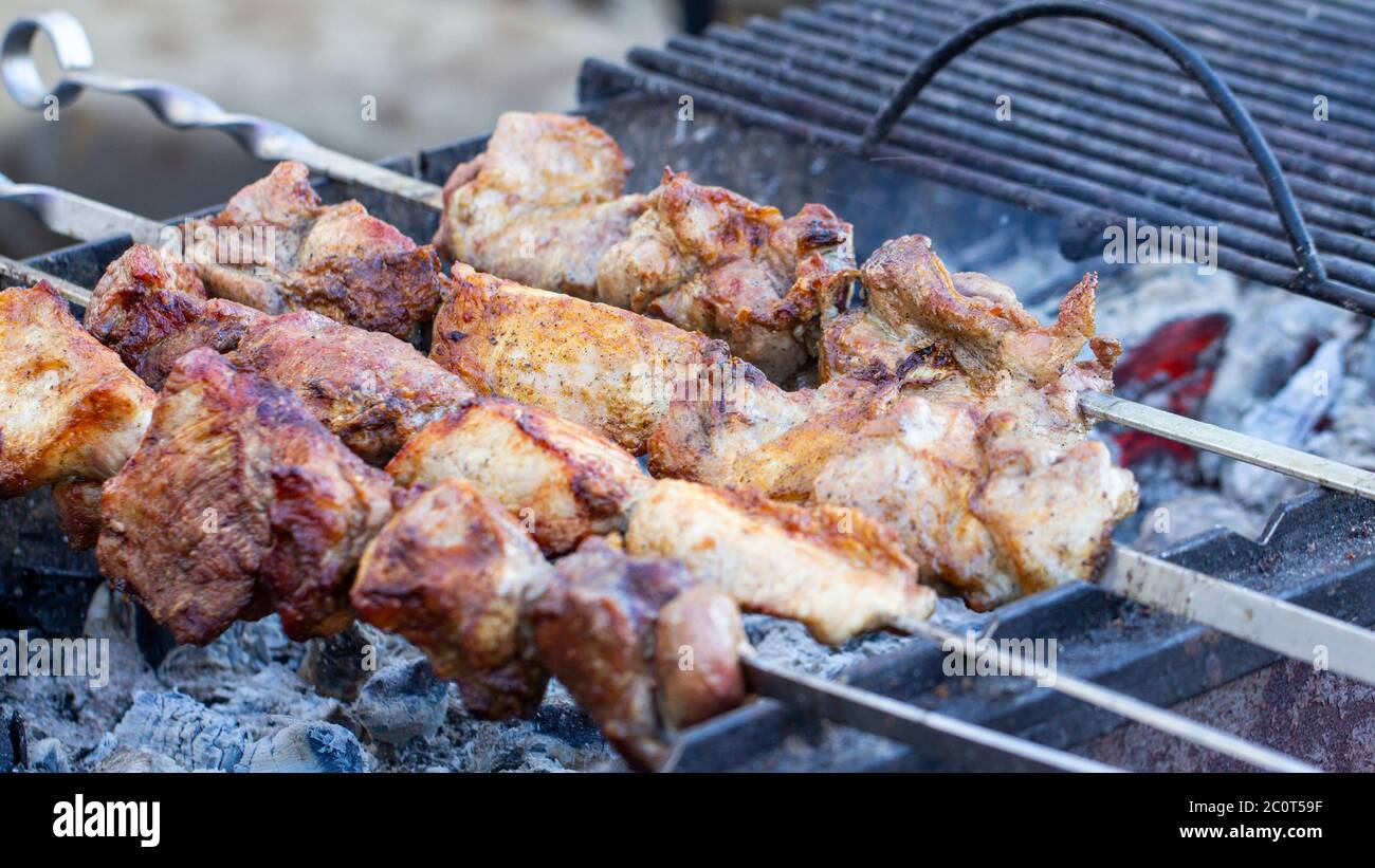Street food, grilled meat on a spit. Homemade Stock Photo - Alamy