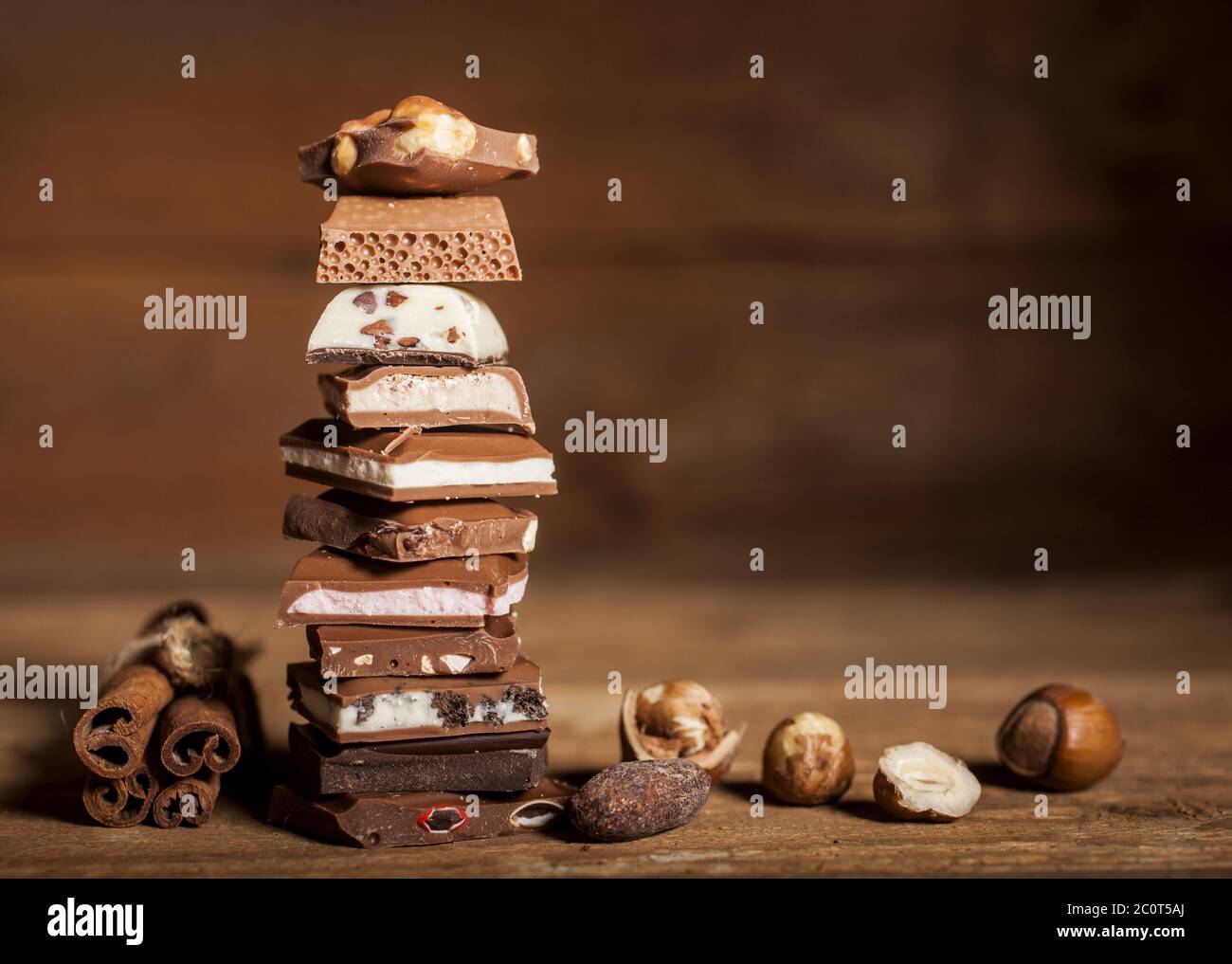 Chocolate stack on wooden background Stock Photo - Alamy